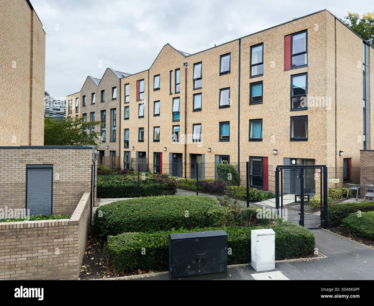 Manchester, UK - September 30, 2025: A modern brick apartment block in ...