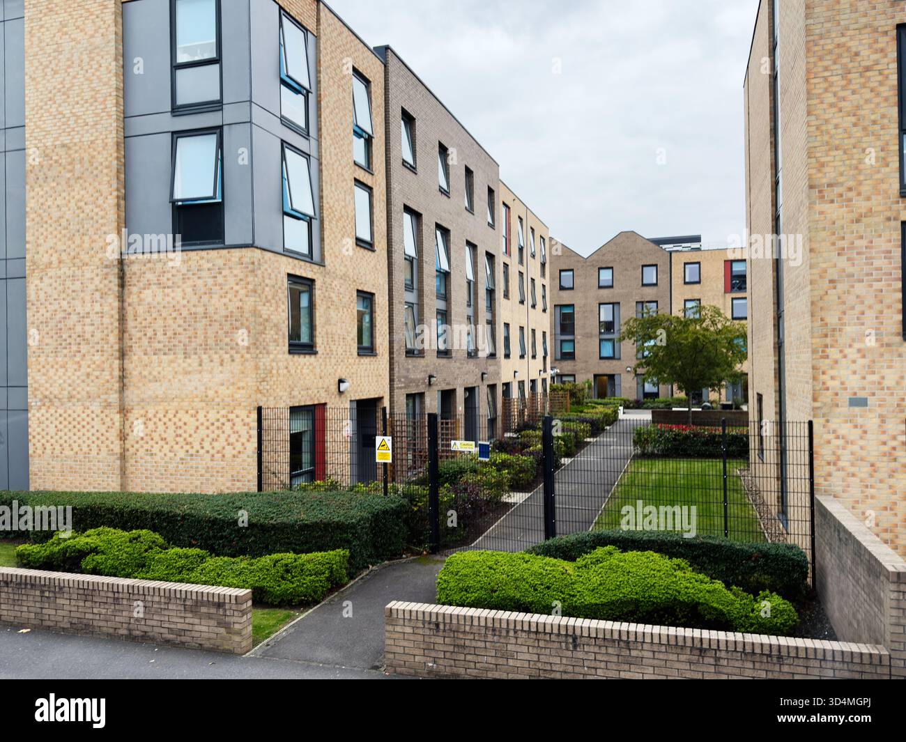 Manchester, UK - September 30, 2025: A modern brick residential complex ...