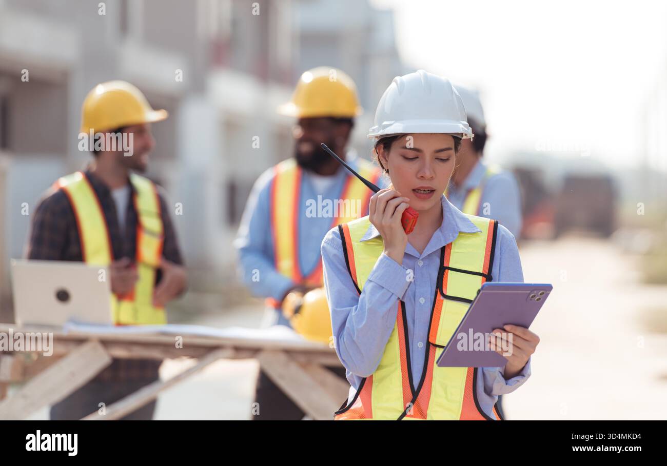 Portrait of engineers work together to assess the residential home ...
