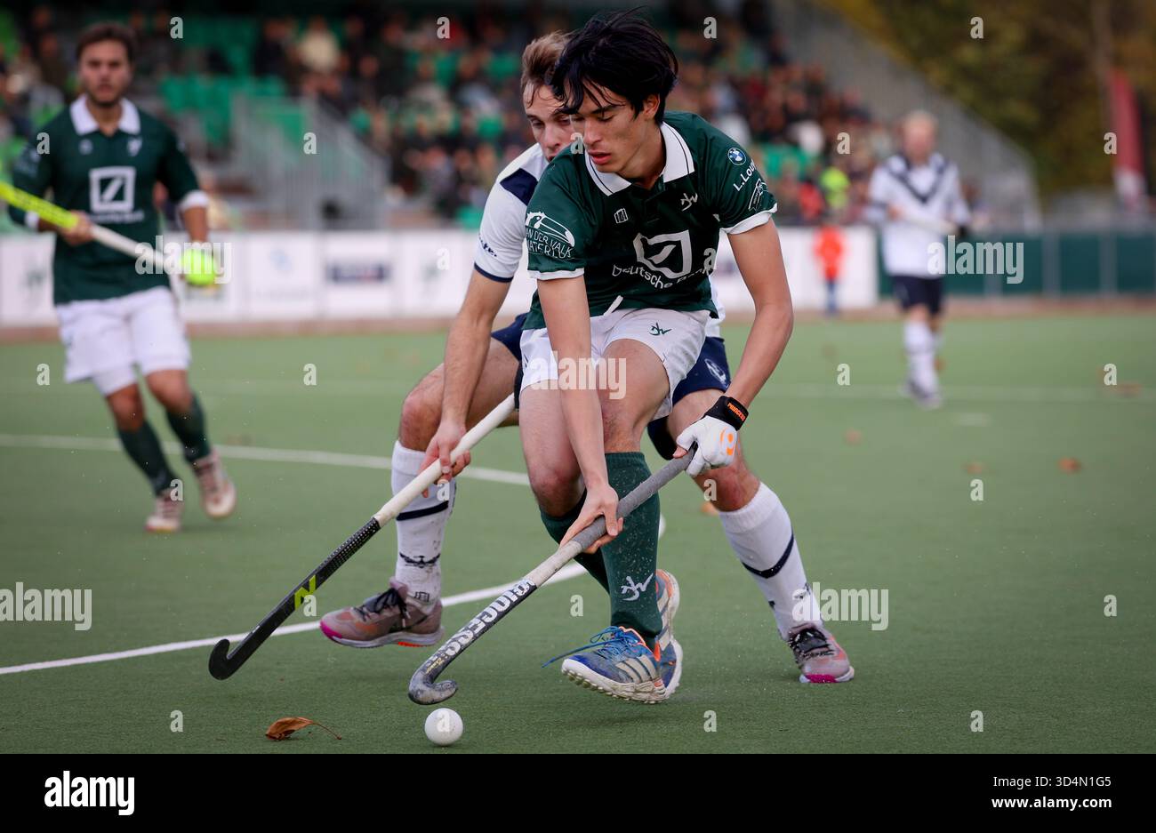 Uccle's Amaury Bellenger and WatDucks' Yujin Murabit fight for the ball ...