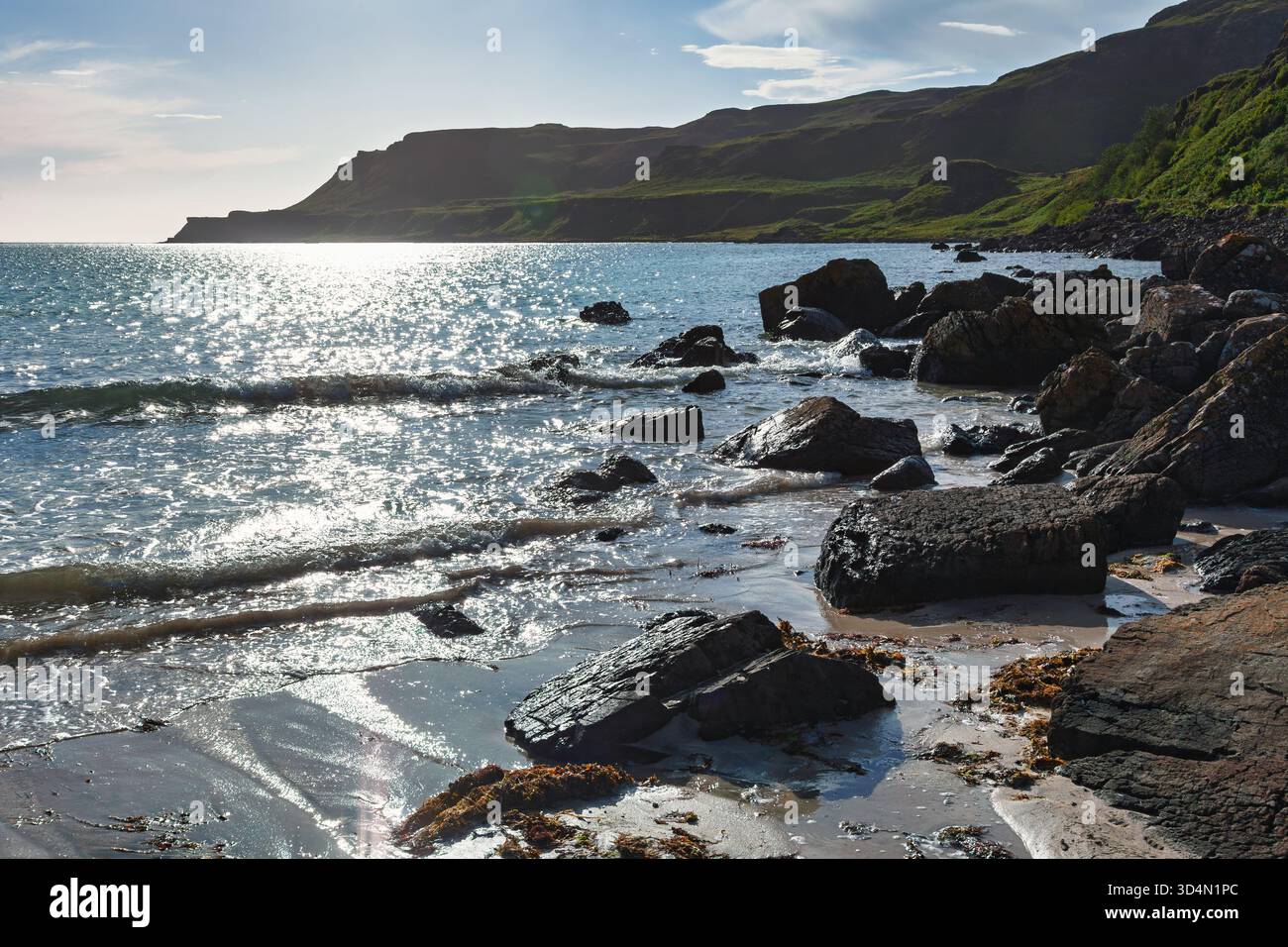 Rocky shoreline at Calgary Bay on the Isle of Mull, Scotland, with ...