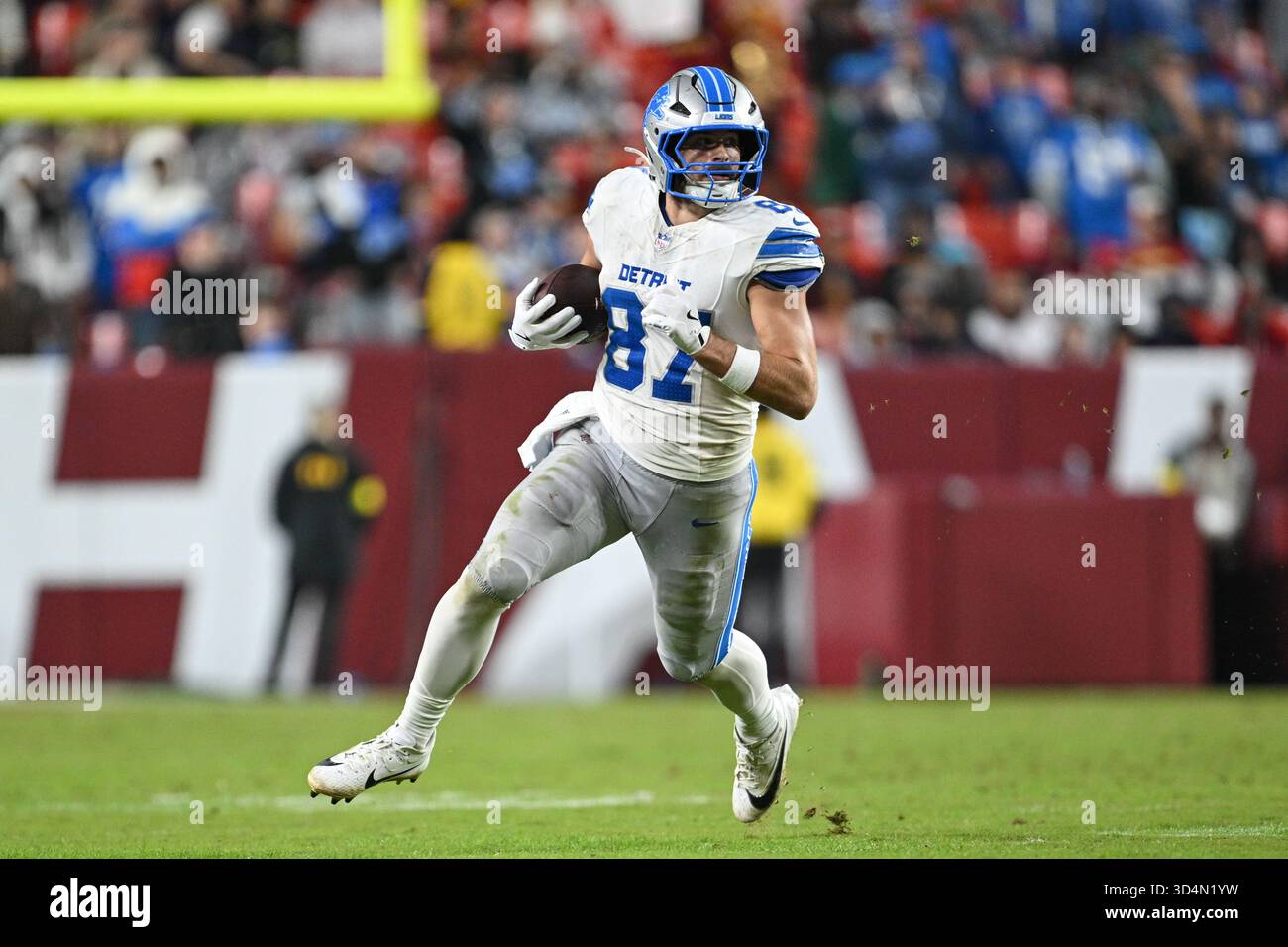 Detroit Lions tight end Sam LaPorta runs with the ball after catching a ...