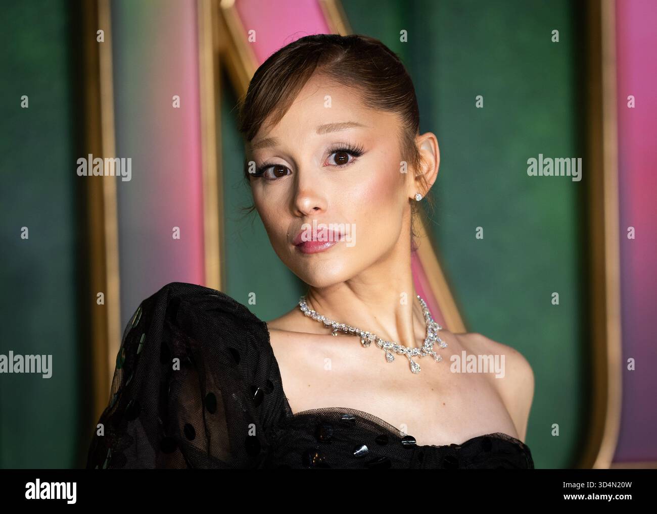 Ariana Grande poses for photographers upon arrival at the premiere of ...