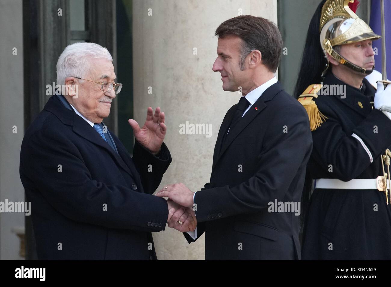 French President Emmanuel Macron, right, welcomes Palestinian President ...