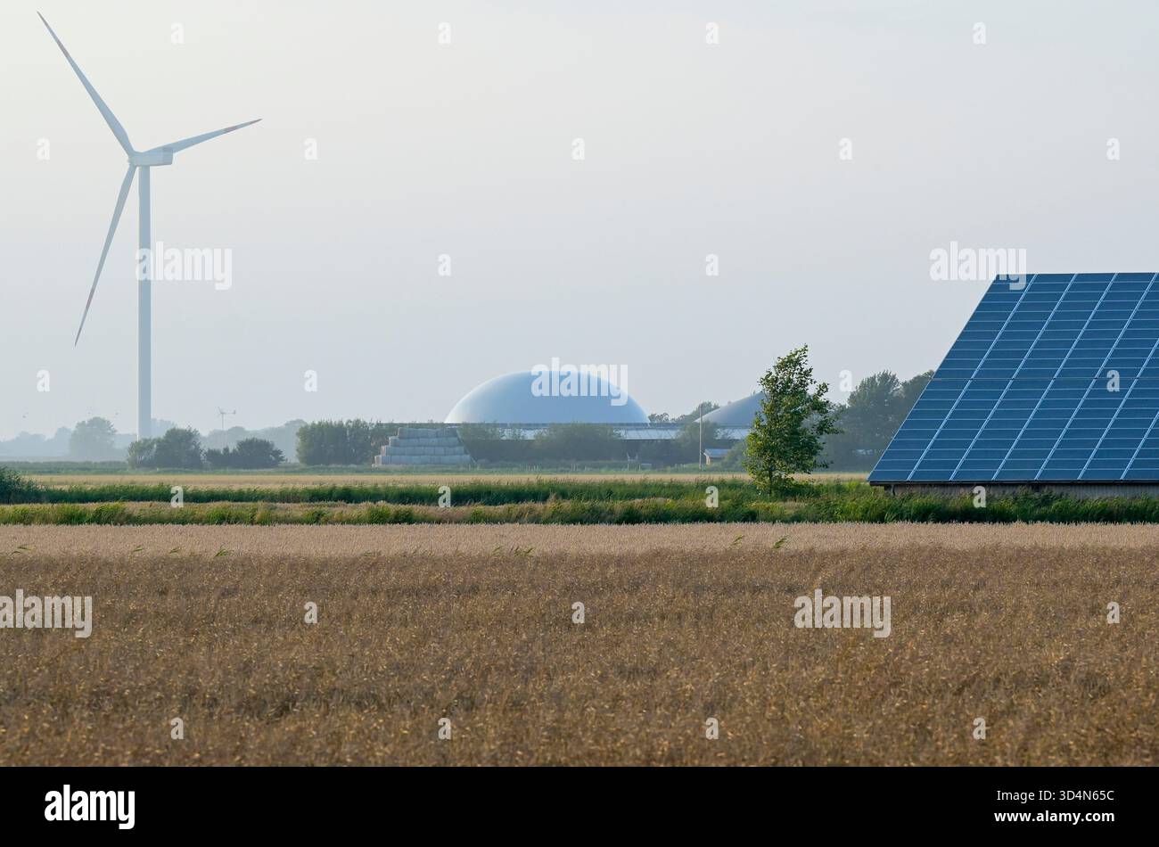 GERMANY, farm with Biogas plant, wind turbine and solar energy ...