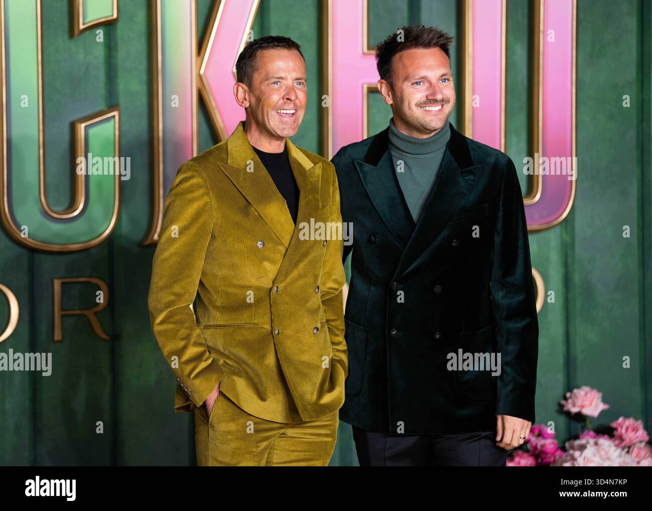 Scott Mills, left, and Sam Vaughan pose for photographers upon arrival ...