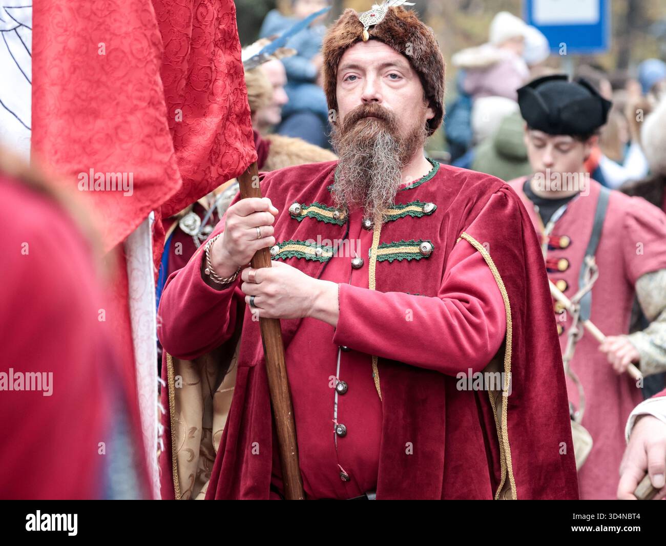 A man dressed in middle age traditional Polish dress participates in ...