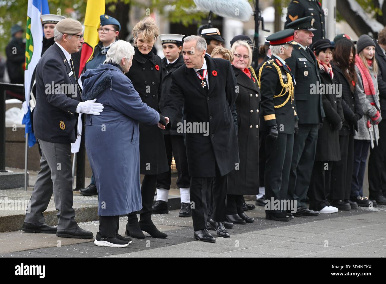 Prime Minister Mark Carney, right, greets National Silver Cross Mother ...