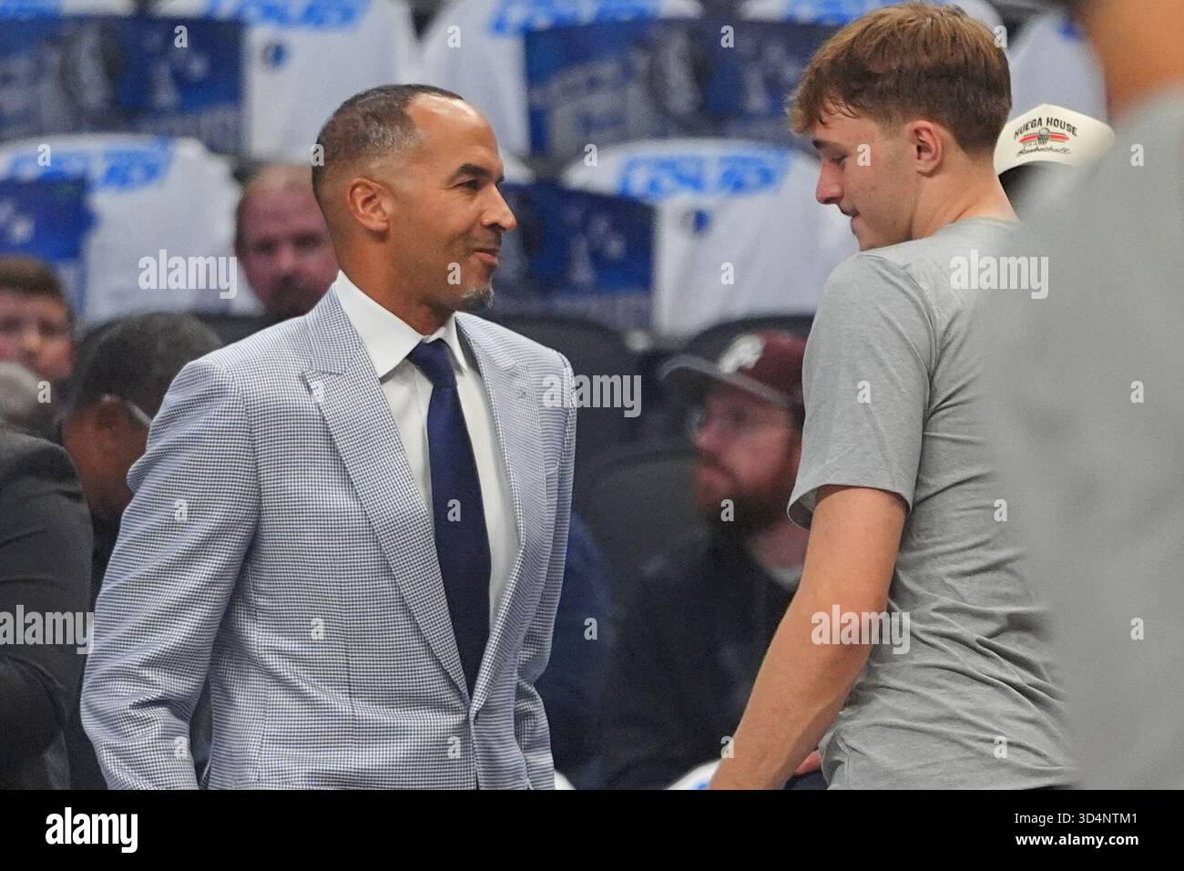 Dallas Mavericks general manager Nico Harrison, left, greets forward ...