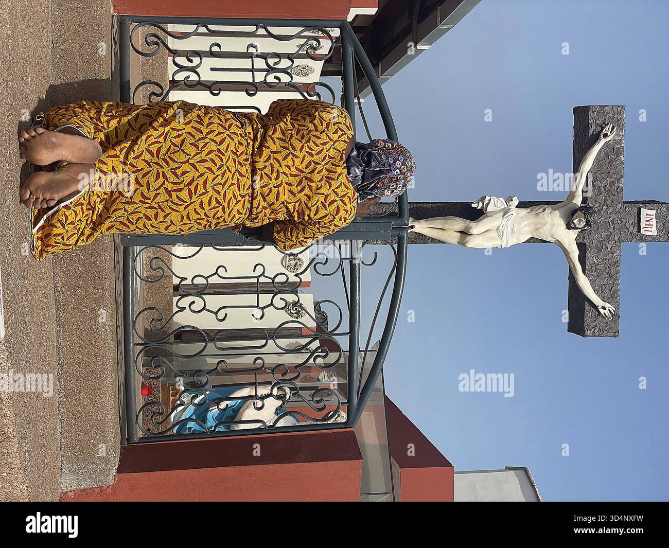 Woman praying at Our Lady of Mercy catholic cathedral, Cotonou, Benin ...