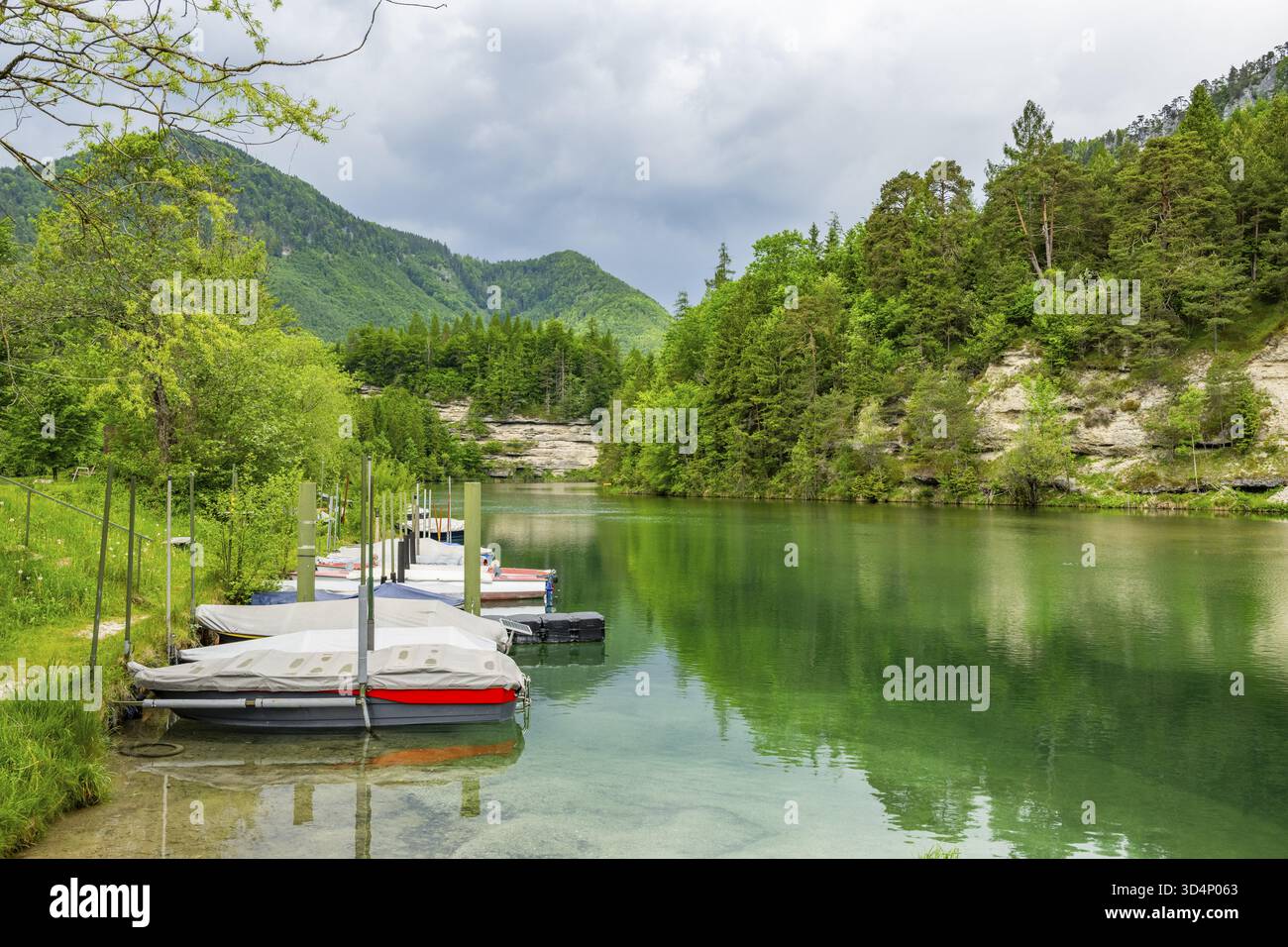 Boats lying on lake elisabethsee on cloudy day in spring hi-res stock ...