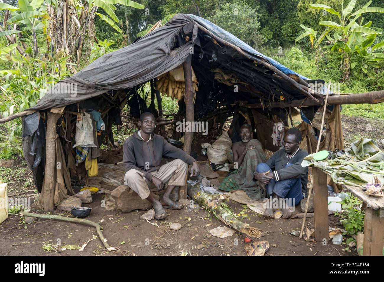 Hermit with two visitors in his hut in the foothills of Mount Kadam ...
