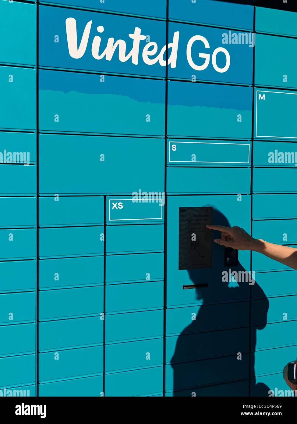 Finestrat, Spain- 10 November 2025: Woman using Vinted go locker ...