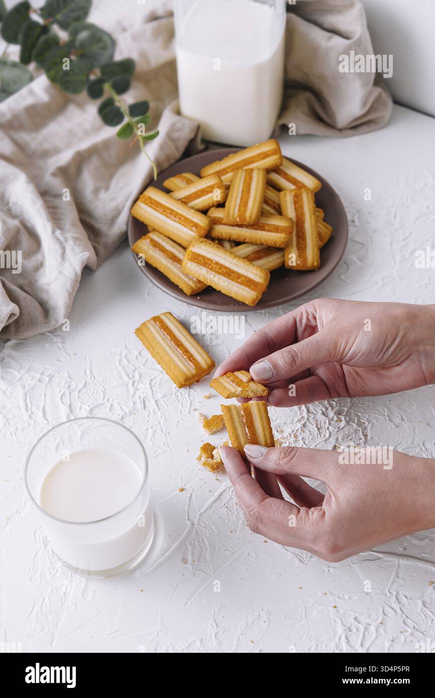 Hands breaking churro hi-res stock photography and images - Alamy