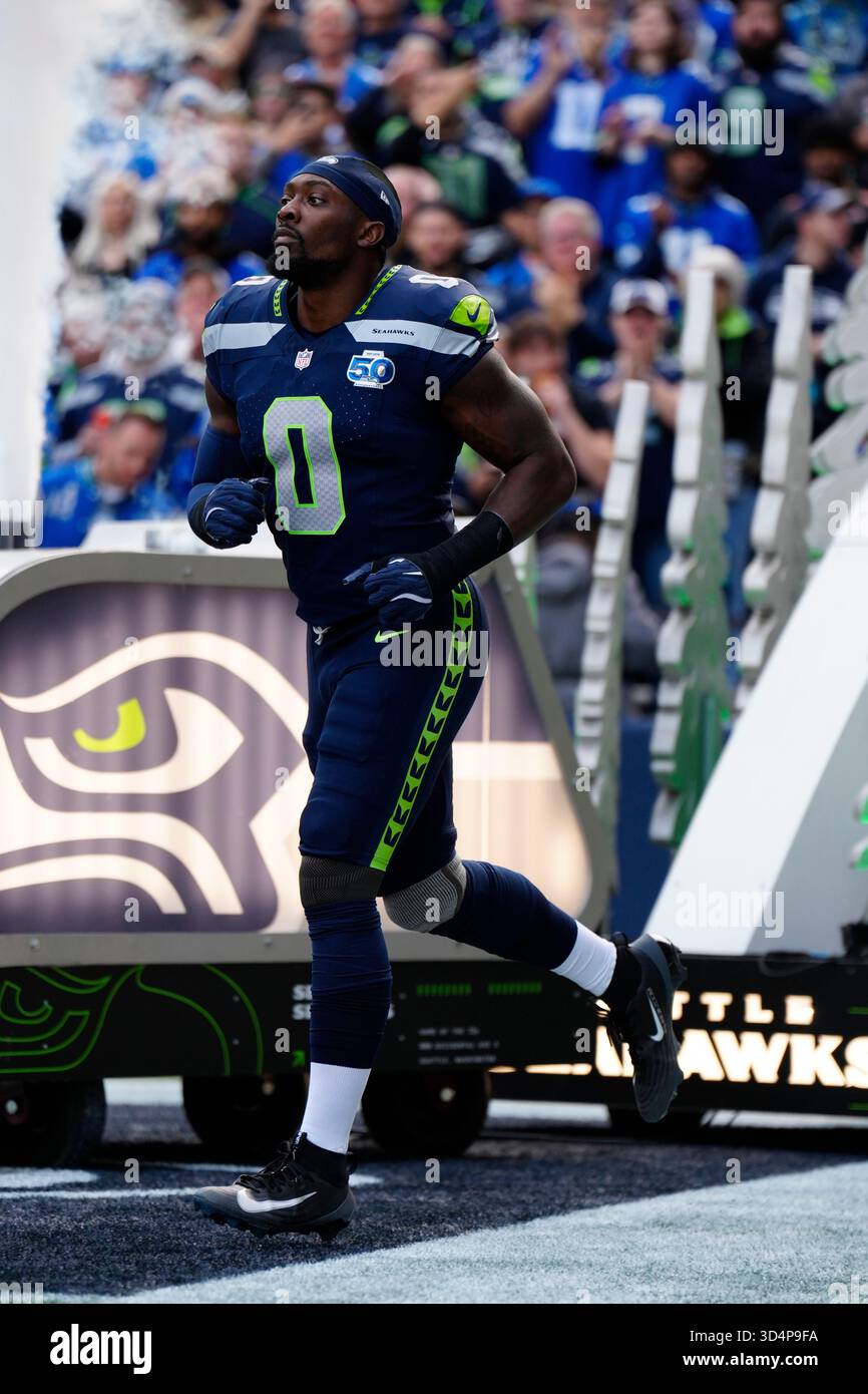 Seattle Seahawks defensive end DeMarcus Lawrence (0) runs out on to the ...