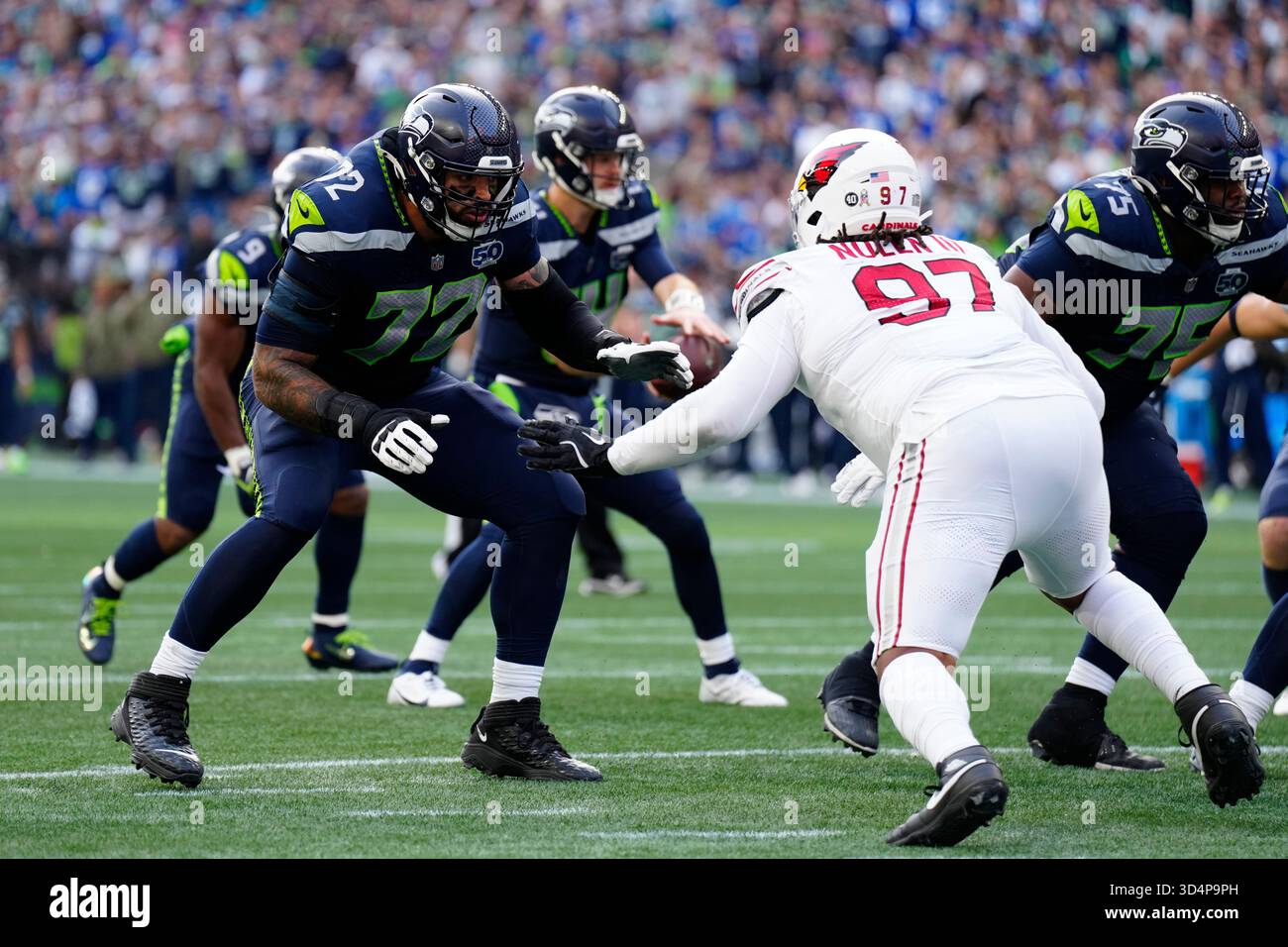 Seattle Seahawks offensive tackle Abraham Lucas (72) faces off against ...