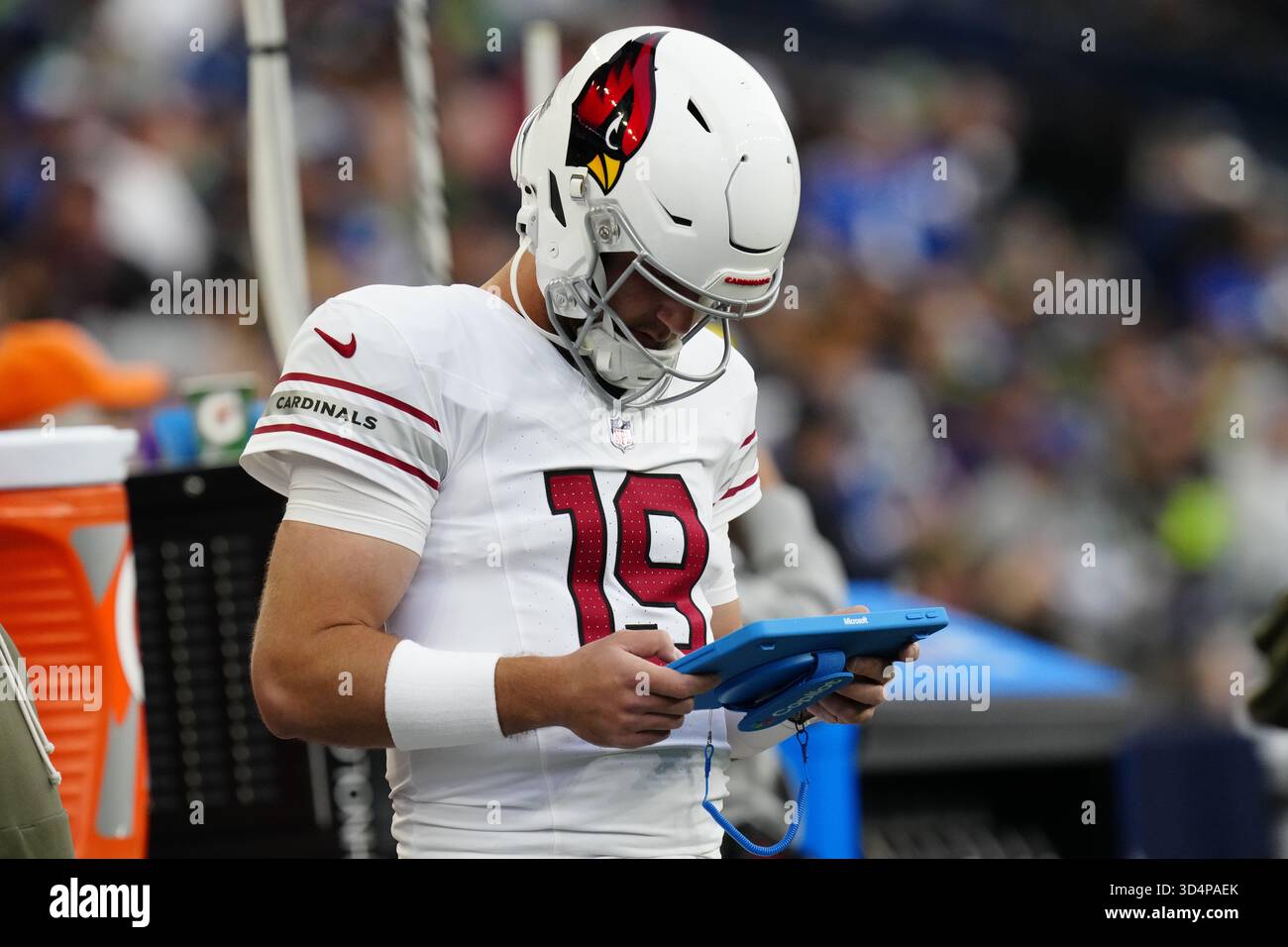 Arizona Cardinals quarterback Kedon Slovis (19) looks at a Microsoft ...