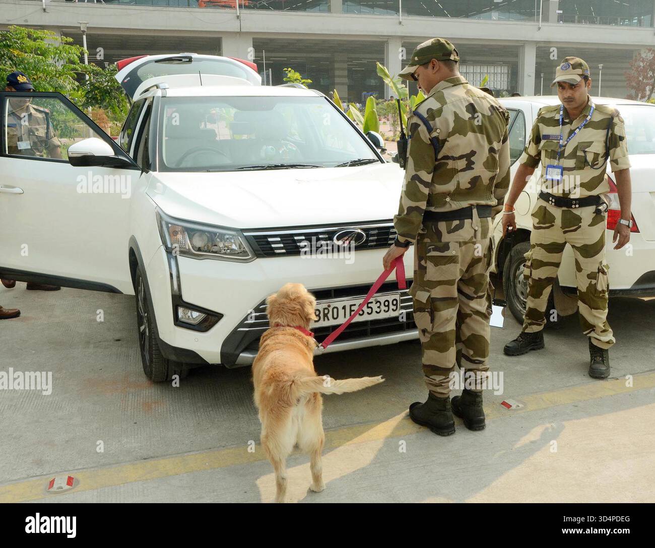 PATNA, INDIA - NOVEMBER 11: NSG and CISF personnel with a sniffer dog ...