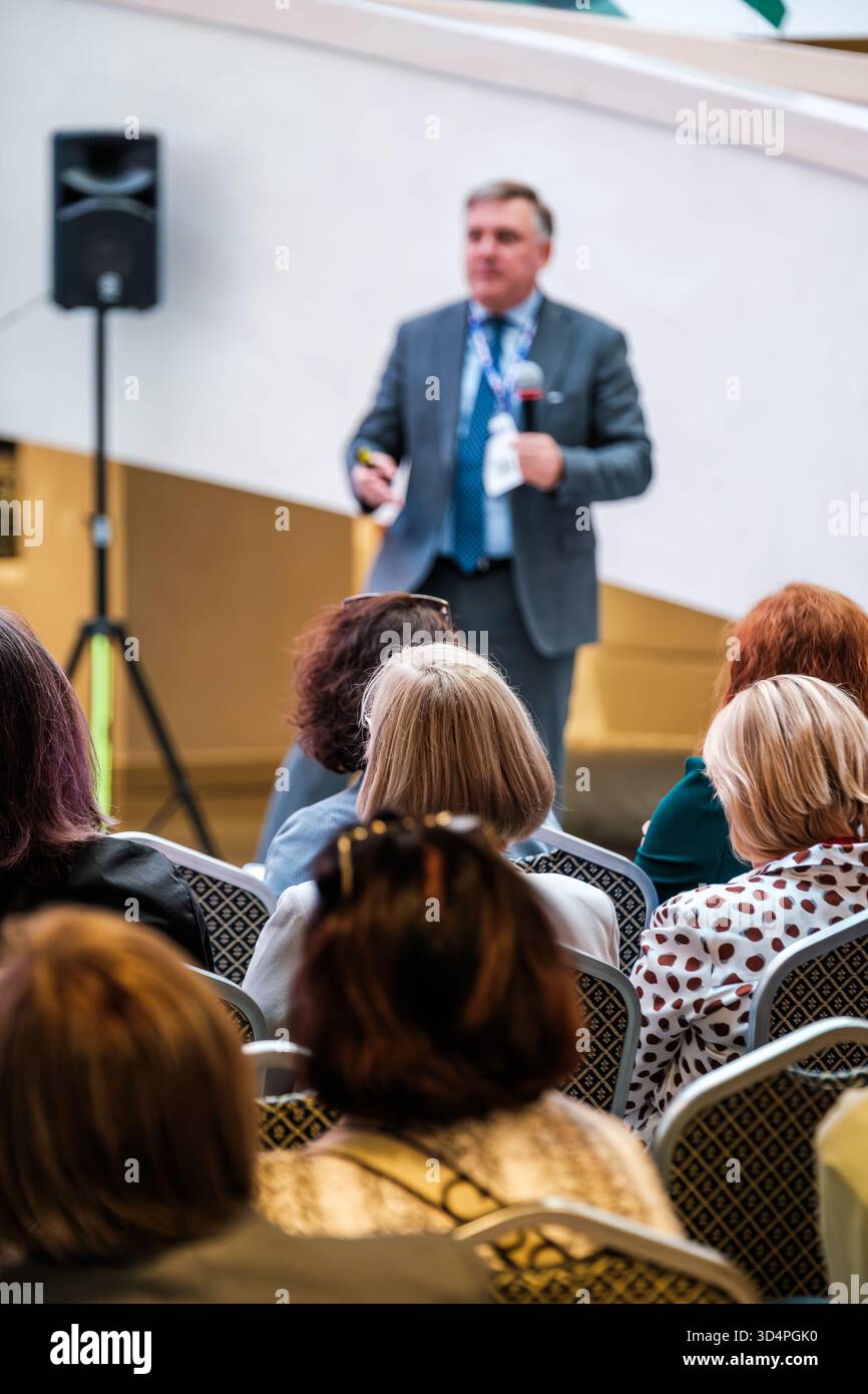 Speaker delivers presentation seated audience hi-res stock photography ...