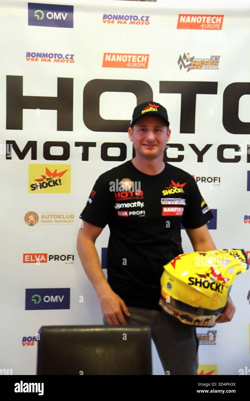 Racer Martin Michek speaks at a press conference where his new factory ...