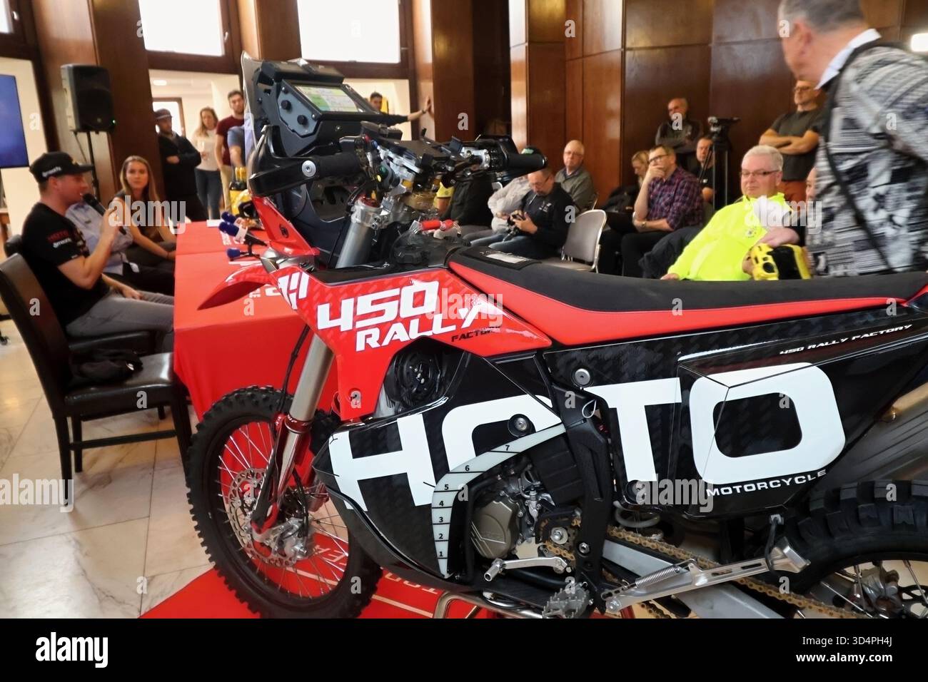 Racer Martin Michek speaks at a press conference where his new factory ...