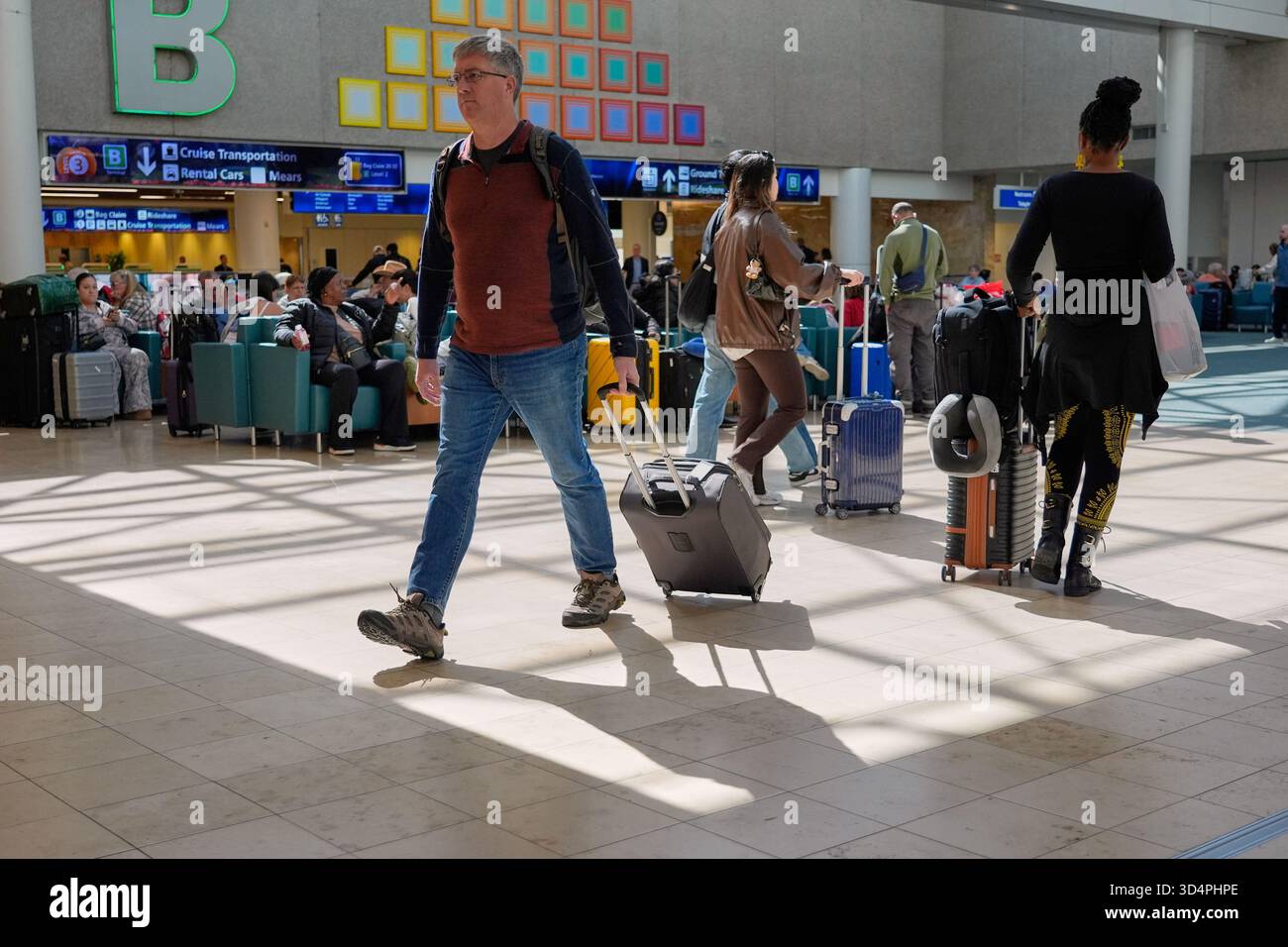 Travelers make there way through Terminal B at Orlando International ...