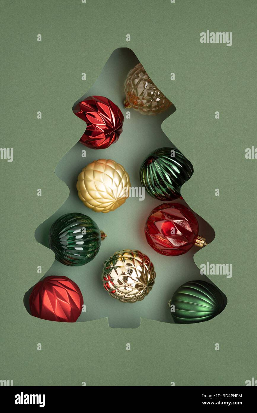 Christmas Tree Cutout Filled with Colorful Ornaments on Green ...