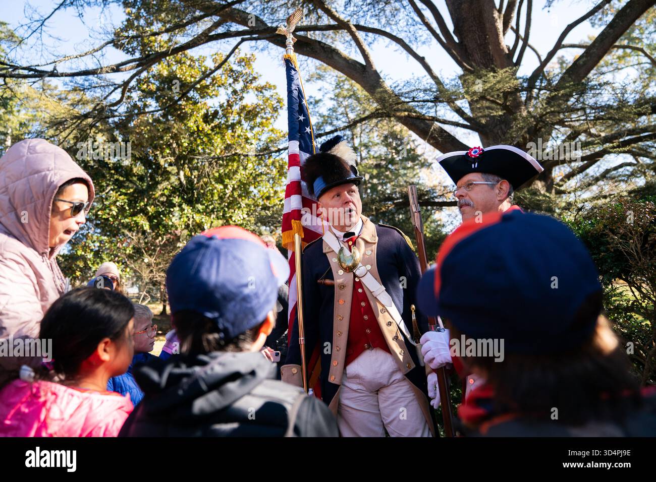 Members of the color guard speak to Cub Scouts before the Veterans Day ...