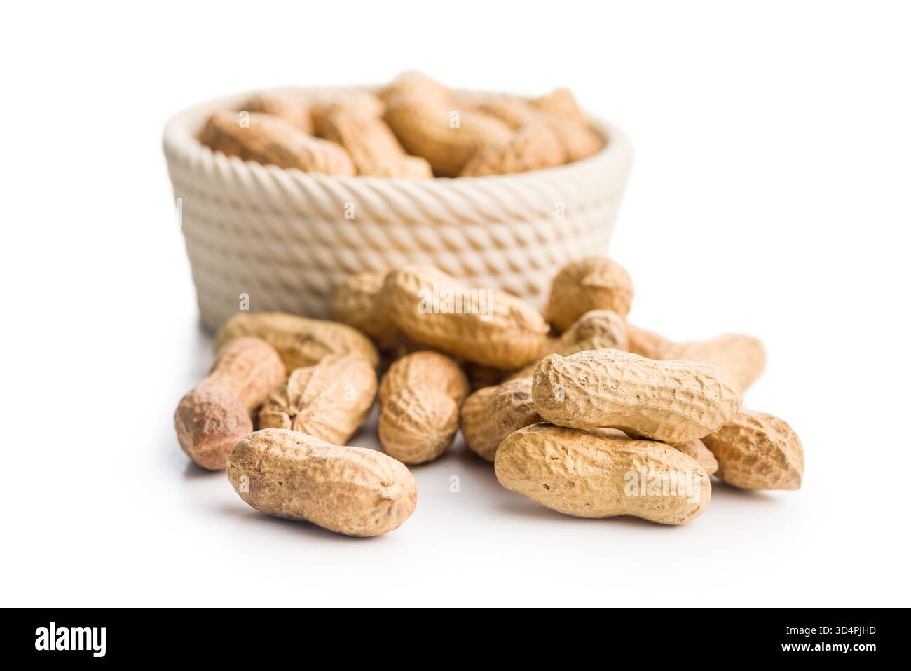 Peanuts in shell. Groundnuts in bowl isolated on a white background ...