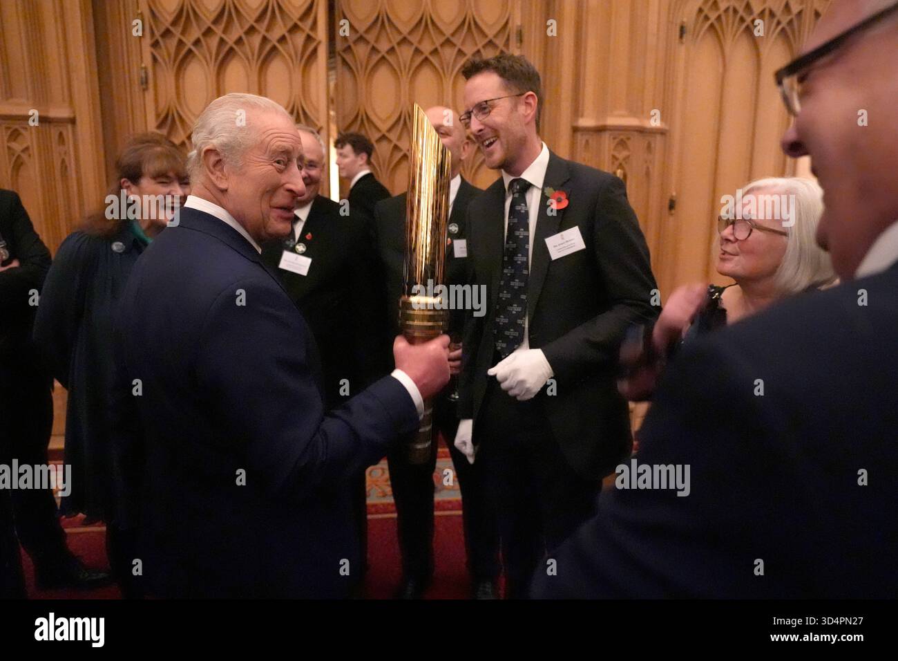 King Charles III holding a torch of peace from the Commonwealth War ...