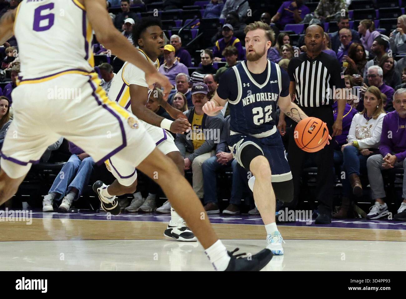 UNO Privateers guard Coleton Benson (22) tries to drive past LSU Tigers ...