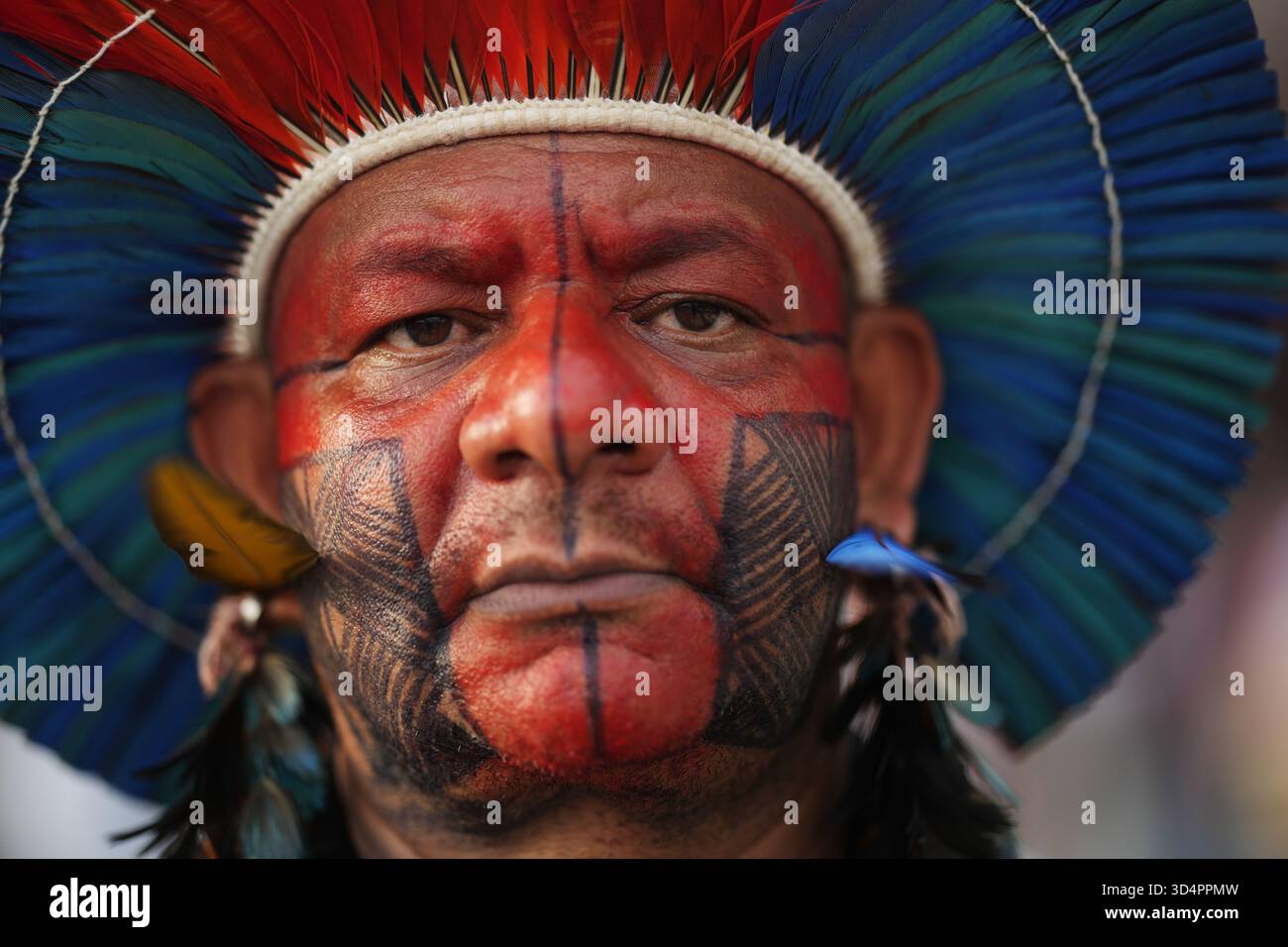Garapira Pataxo, from the Pataxo Indigenous community, poses for photos ...