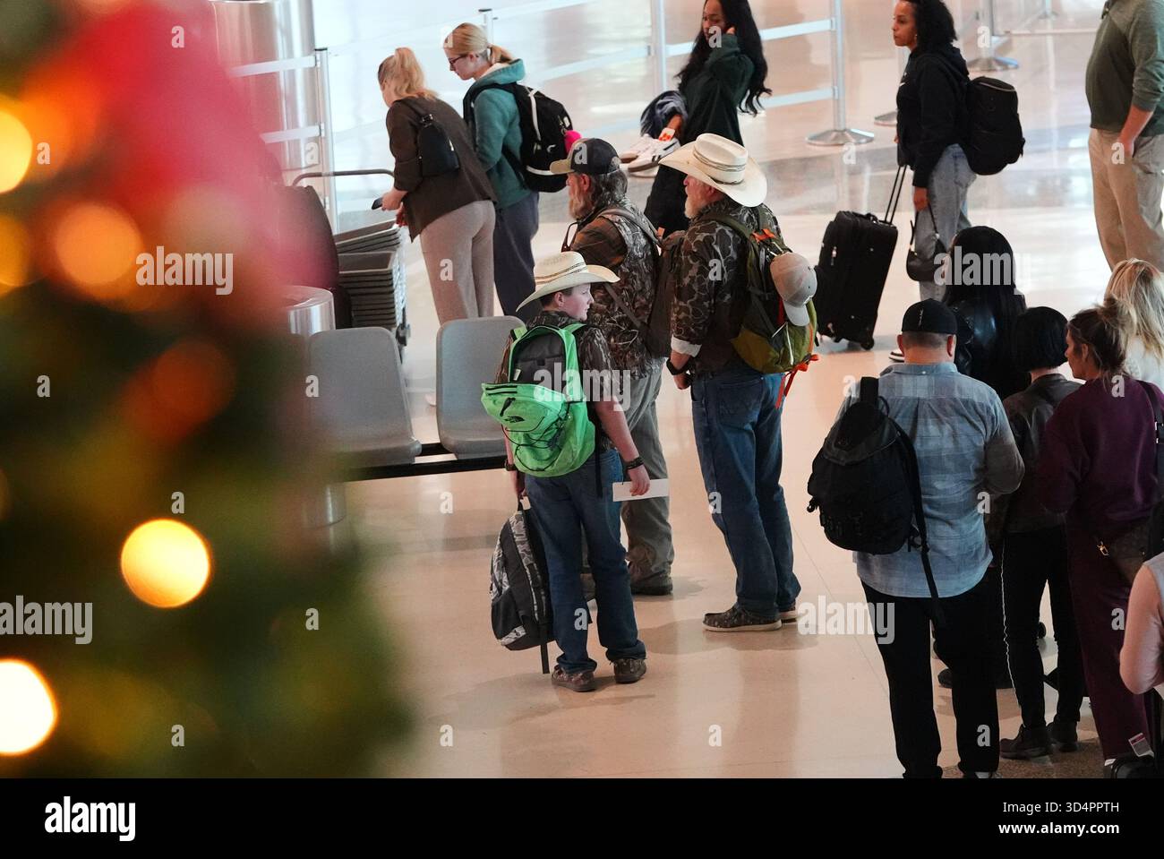 Travelers line up to pass through TSA security at Dallas Love Field ...