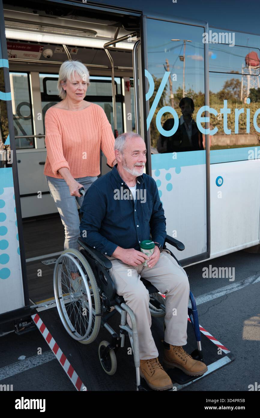 Senior couple using wheelchair ramp on public bus Stock Photo - Alamy