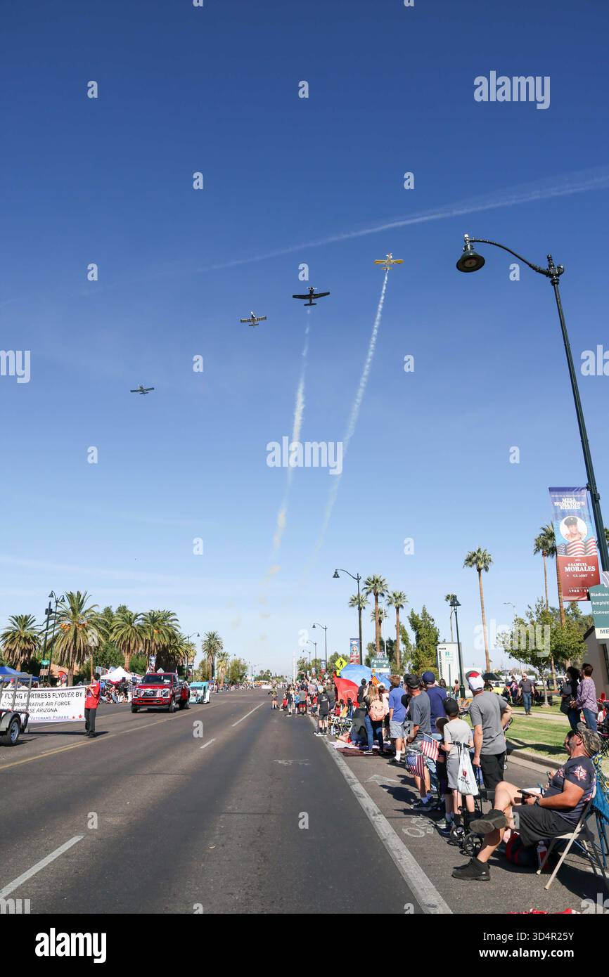 Vintage airplanes fly overhead at the East Valley Veterans Day Parade ...