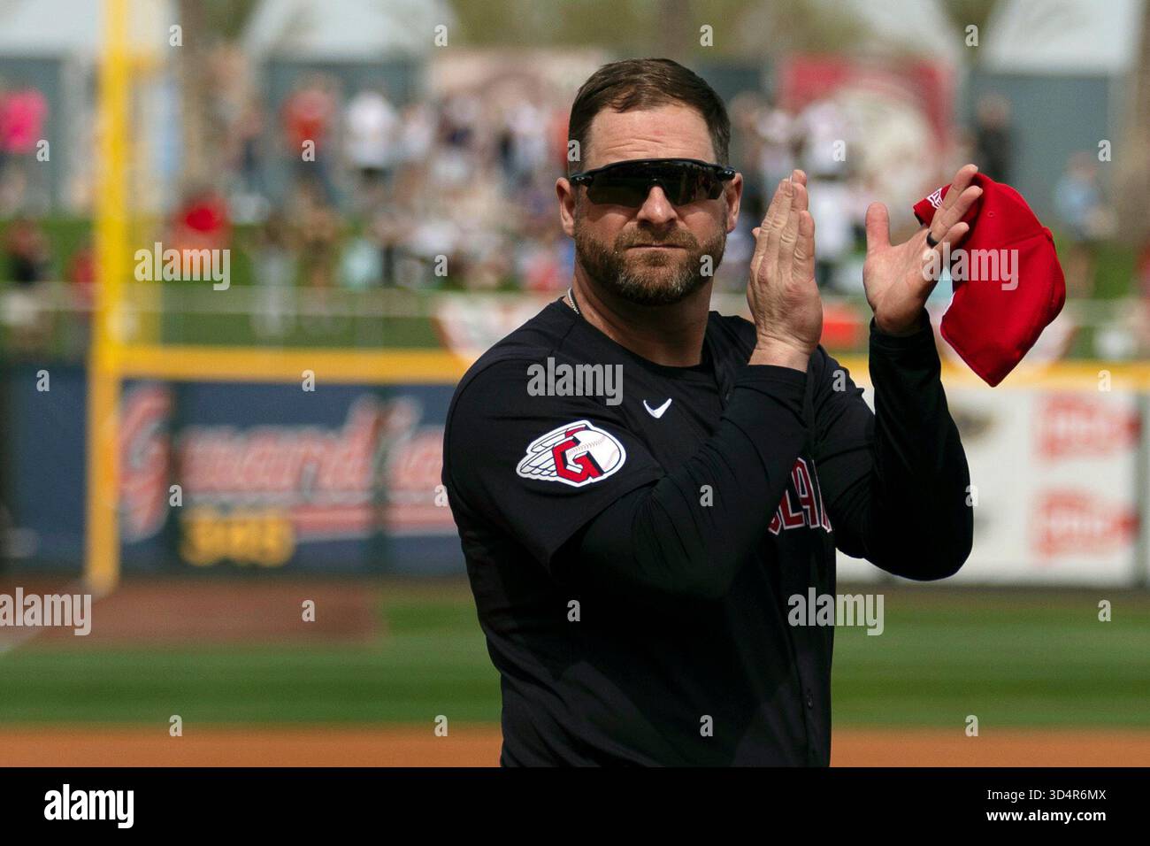 FILE - Cleveland Guardians manager Stephen Vogt turns to acknowledge ...