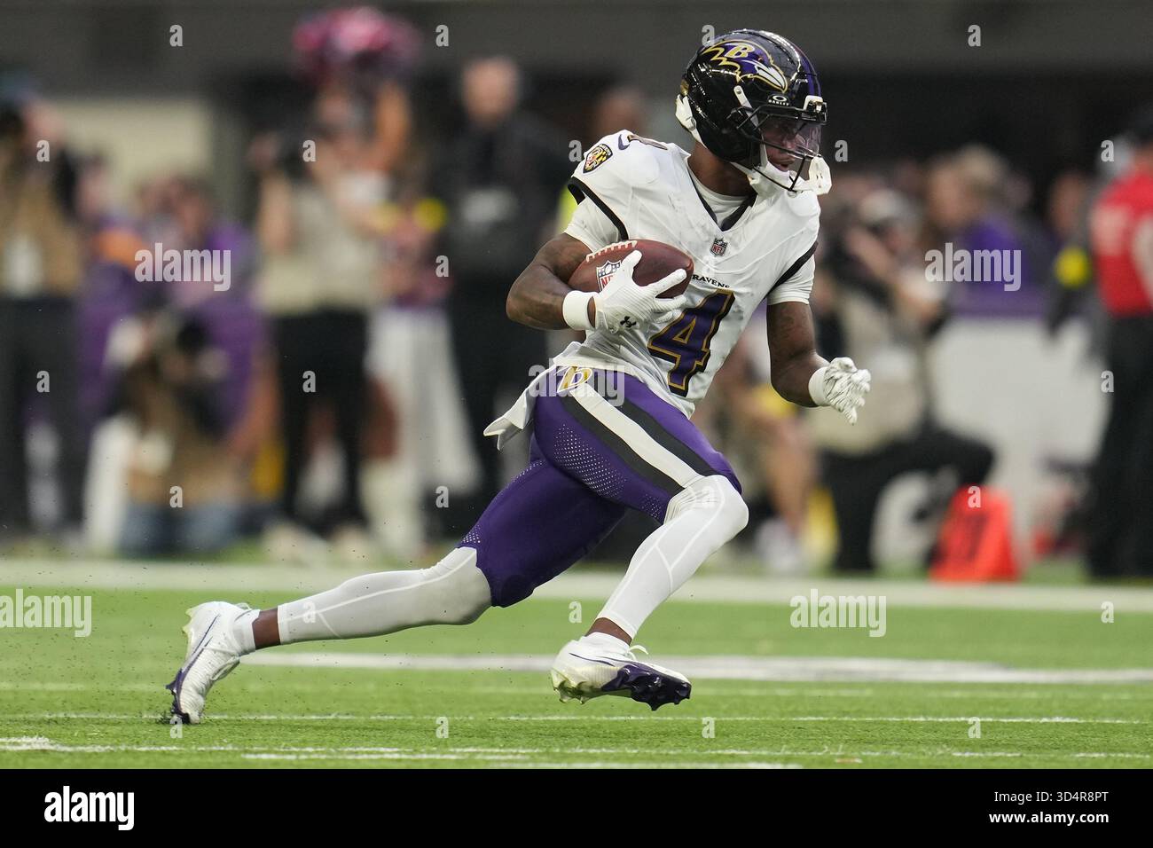 Baltimore Ravens wide receiver Zay Flowers (4) runs with the football ...