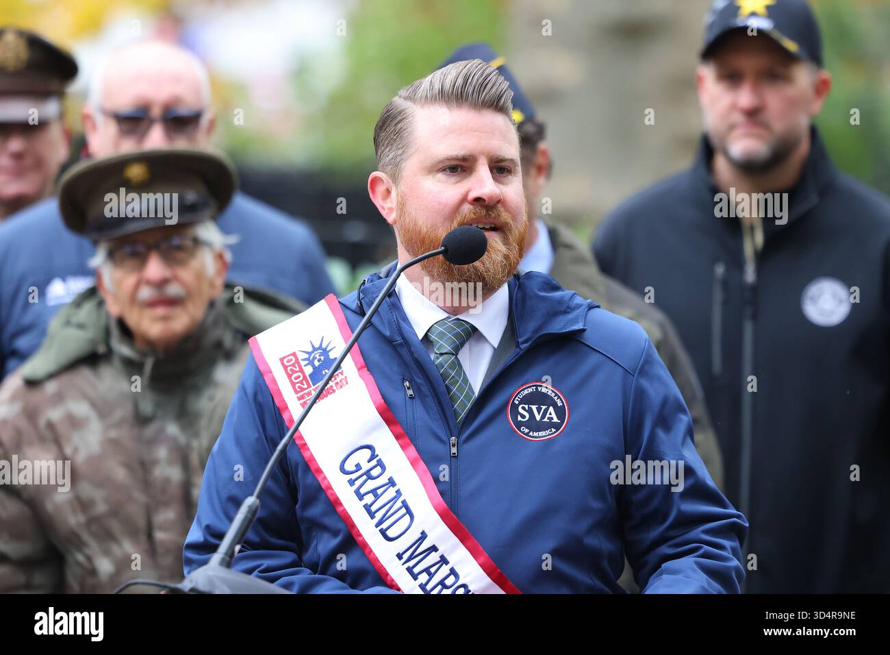 Grand Marshall Jared Lyon speaks during a ceremony before the start of ...