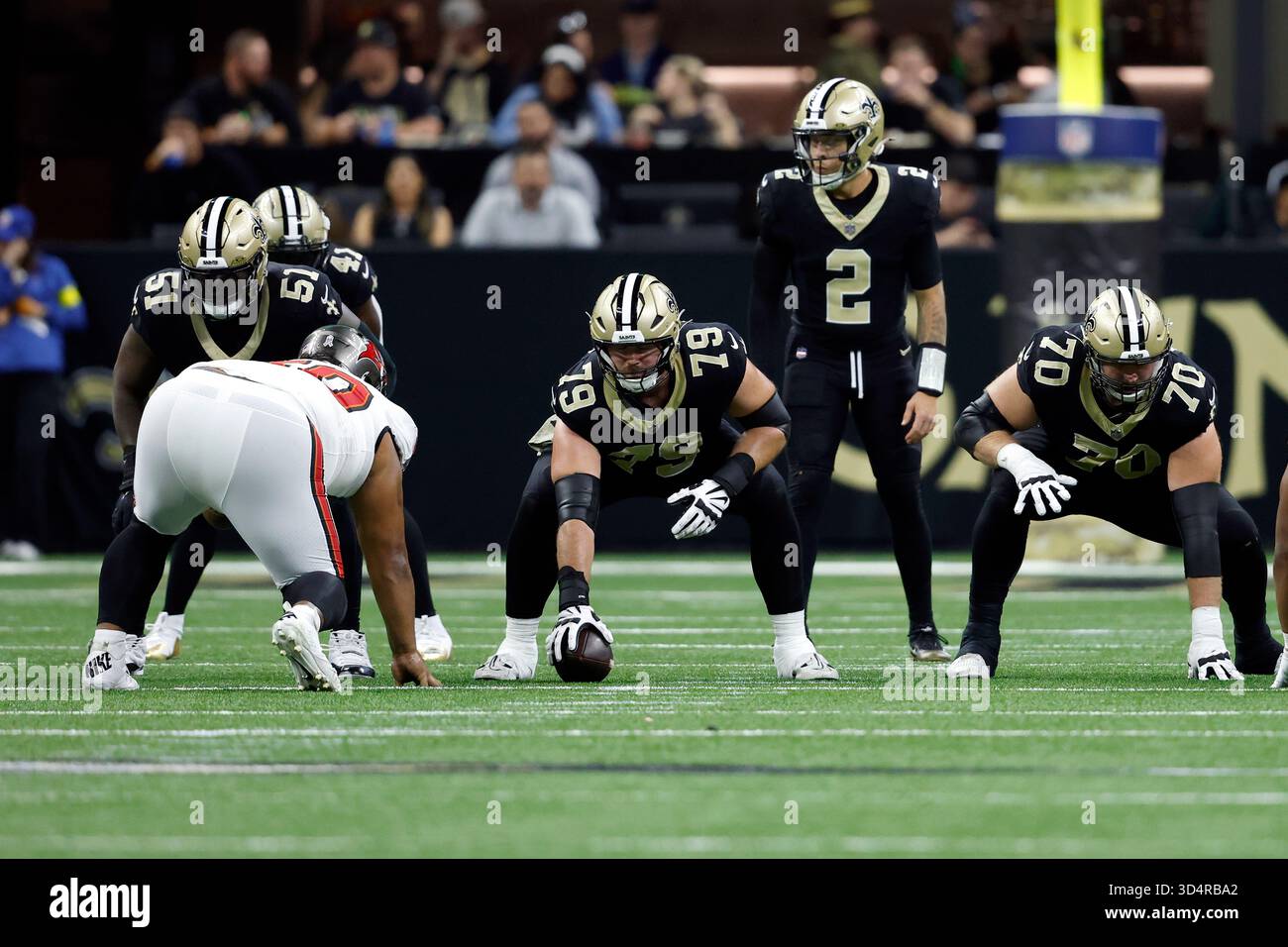 New Orleans Saints center Luke Fortner (79) waits to snap the ball ...