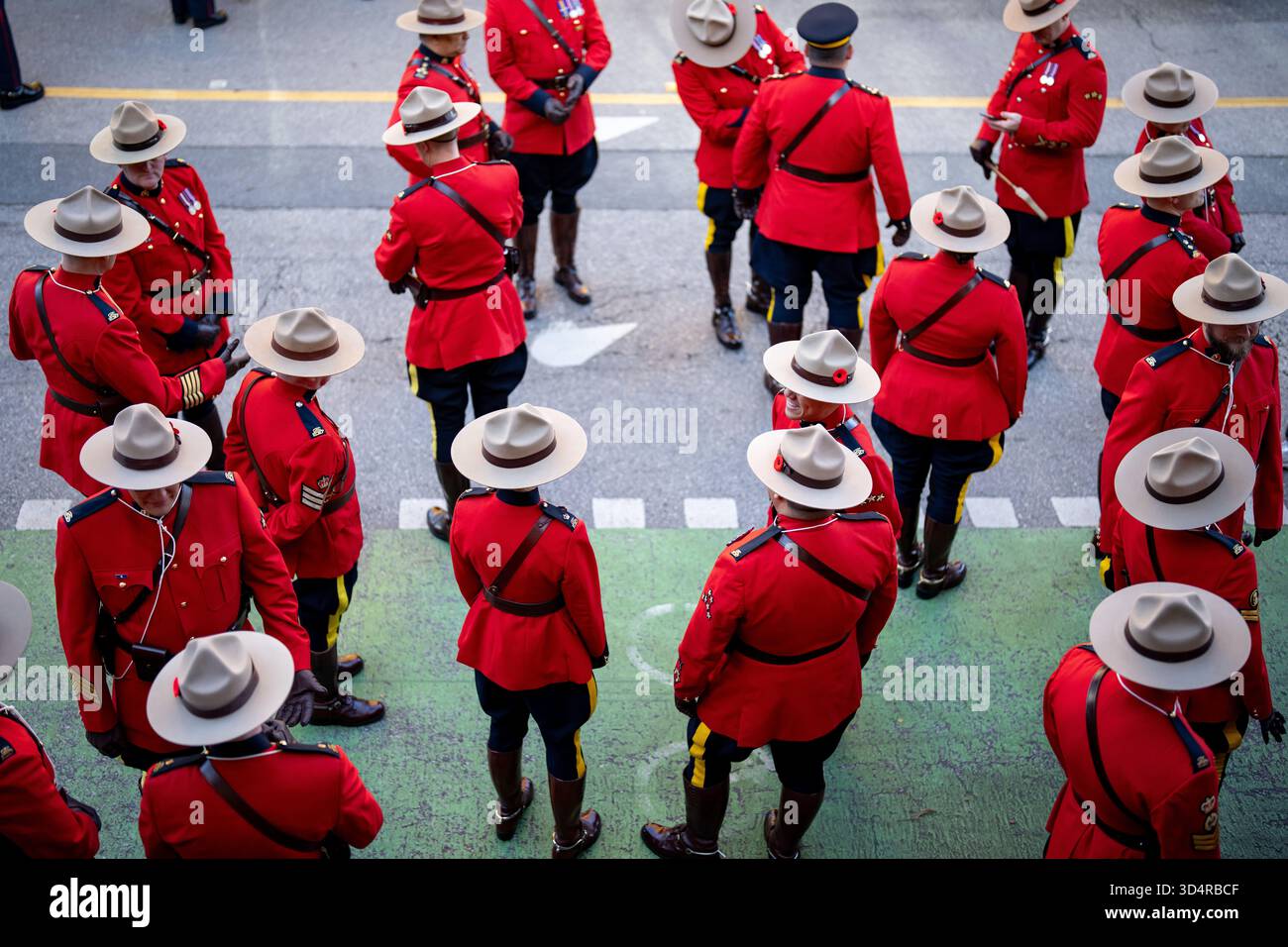 RCMP constables wait to form up for a parade before a Remembrance Day ...