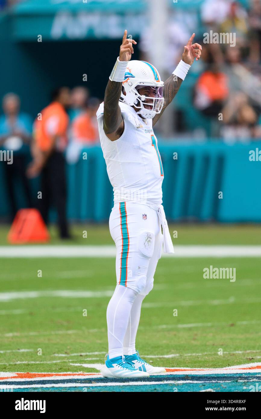 Miami Dolphins quarterback Tua Tagovailoa (1) raises his arms and yells ...