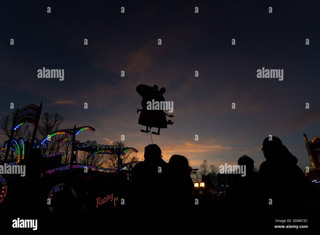 November 11, 2025, Hochheim, Hesse, Germany: A man holds a Peppa Pig ...