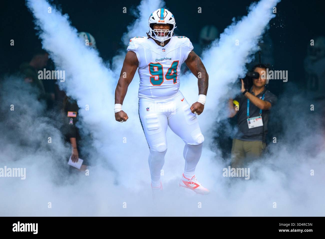 Miami Dolphins defensive tackle Jordan Phillips (94) runs onto the ...
