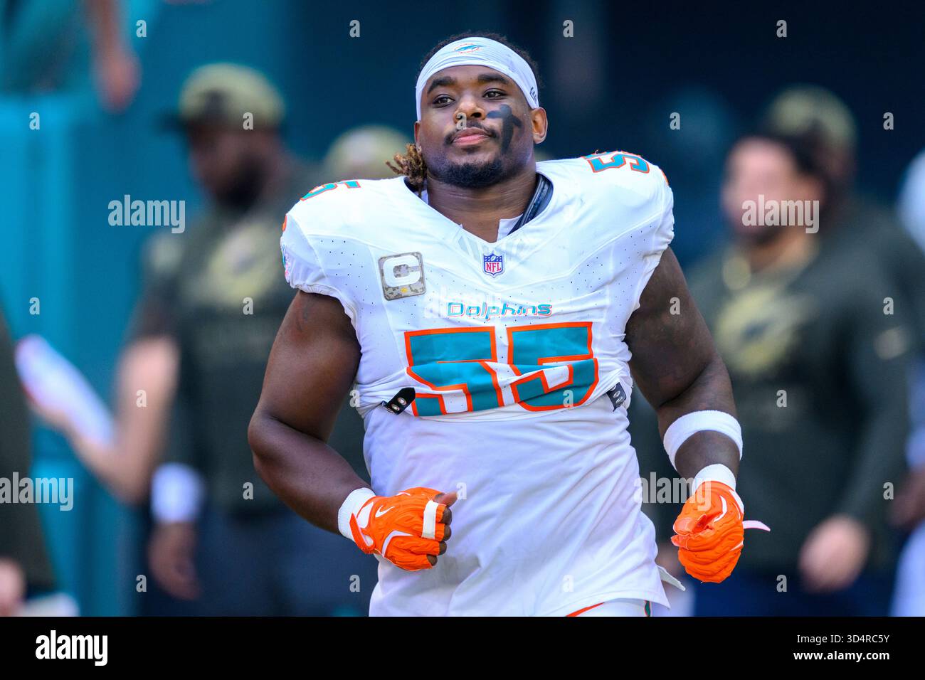 Miami Dolphins offensive lineman Aaron Brewer (55) runs onto the field ...