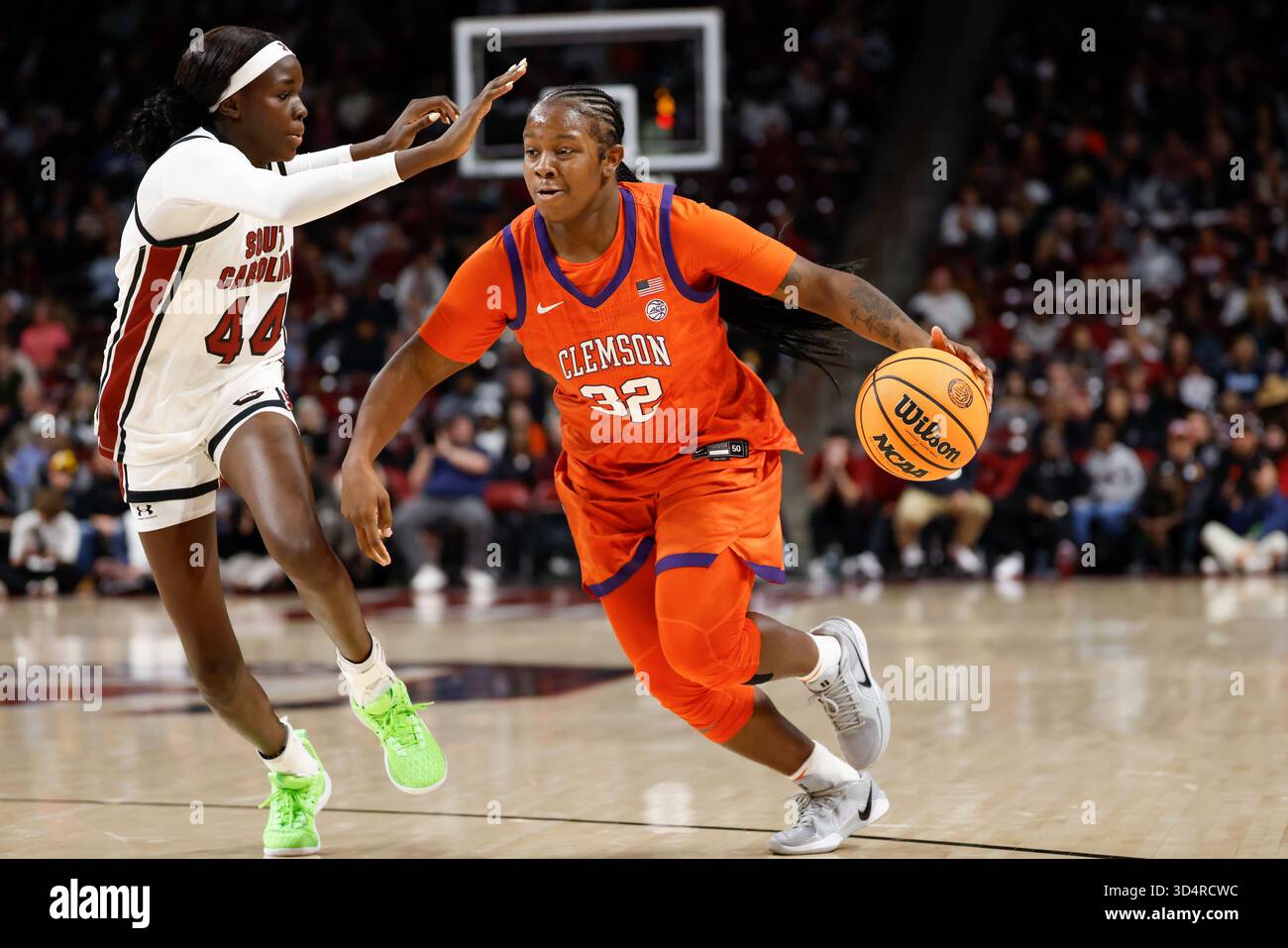 Clemson forward Raven Thompson, right, drives against South Carolina ...