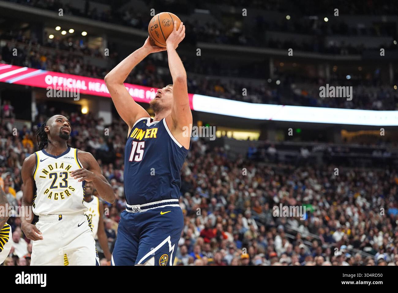 Denver Nuggets center Nikola Jokić (15) and Indiana Pacers guard ...
