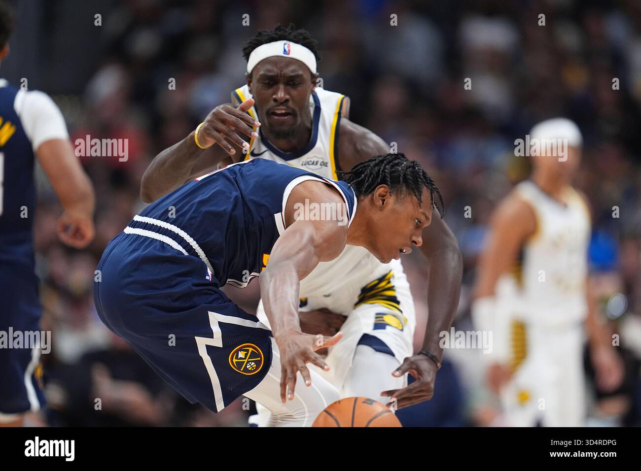 Denver Nuggets guard Peyton Watson (8) and Indiana Pacers forward ...