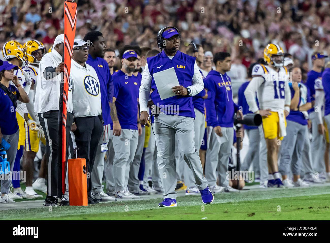 LSU interim head coach Frank Wilson, center, walks the sideline during ...