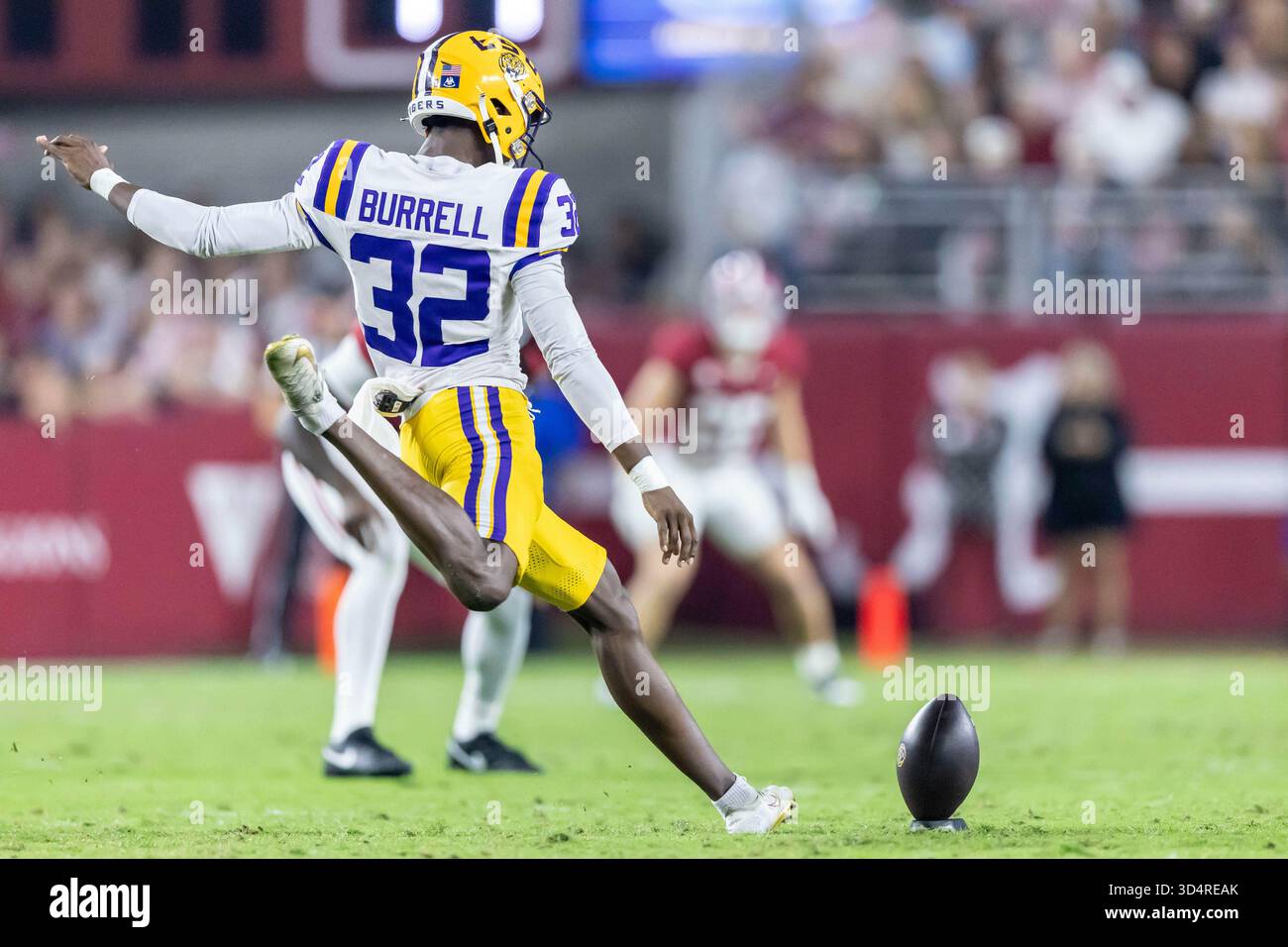 LSU kicker Aeron Burrell (32) kicks off during the second half of an ...