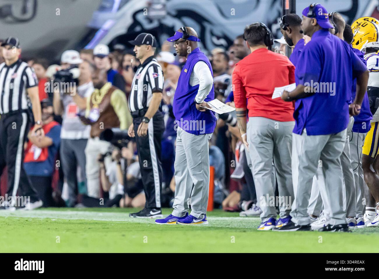 LSU interim head coach Frank Wilson, center, watches his team during ...
